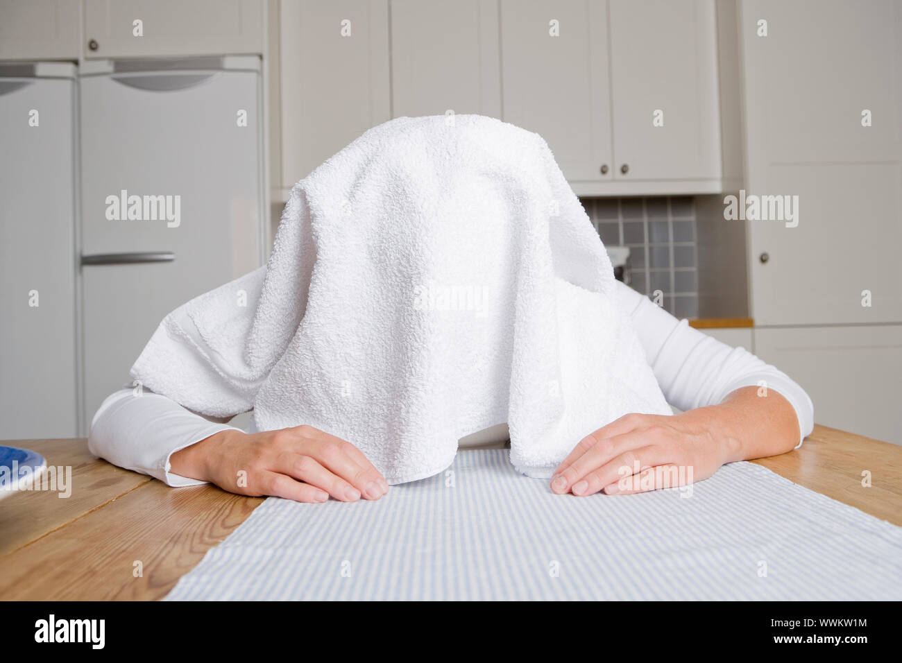 Cold woman with a towel at home Stock Photo - Alamy