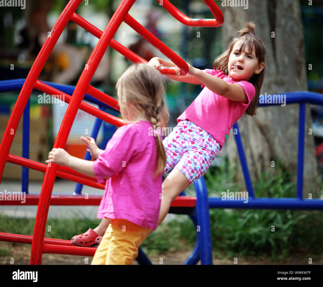 Children playing on playground in park Stock Photo - Alamy