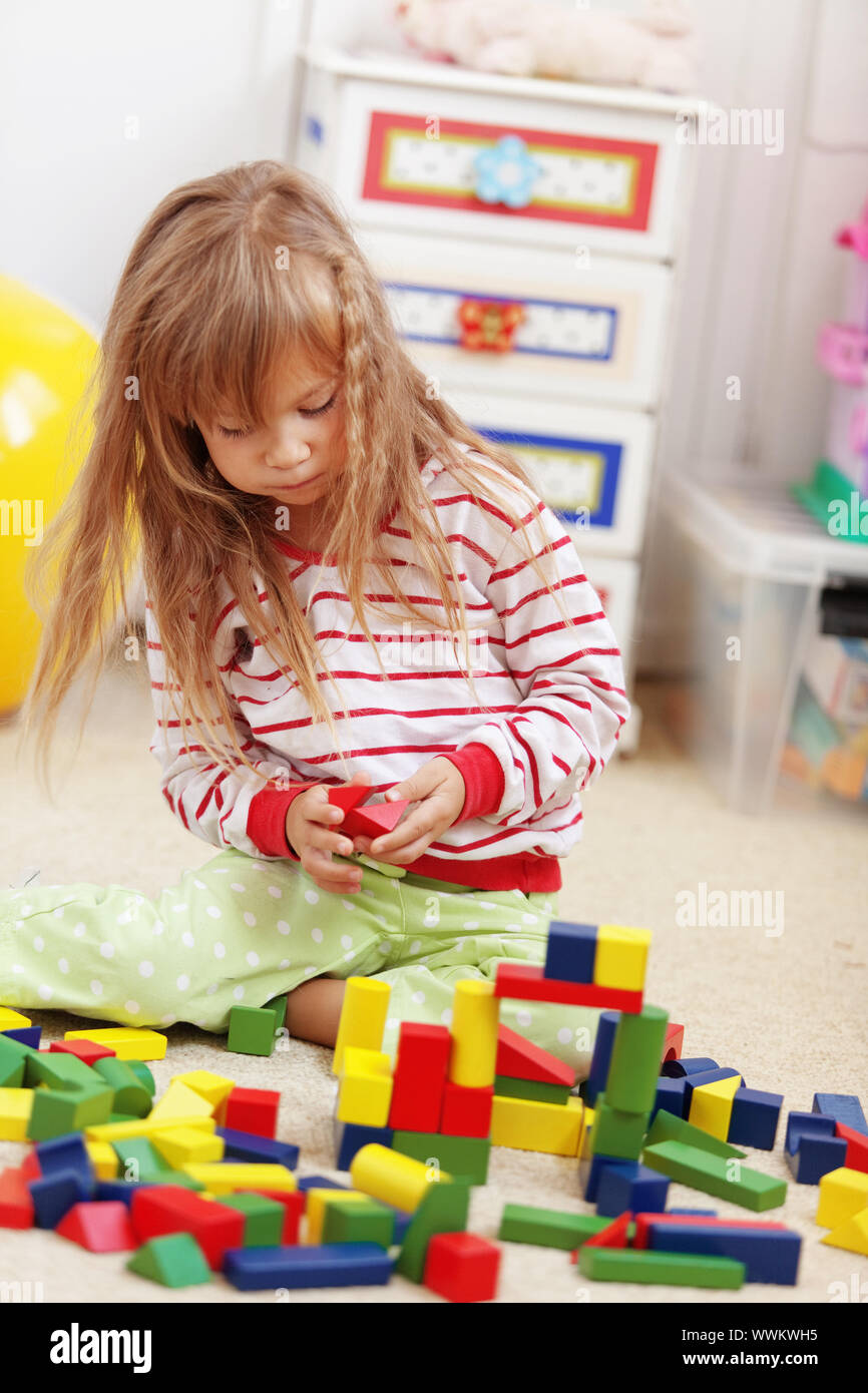 Child playing with bricks Stock Photo - Alamy