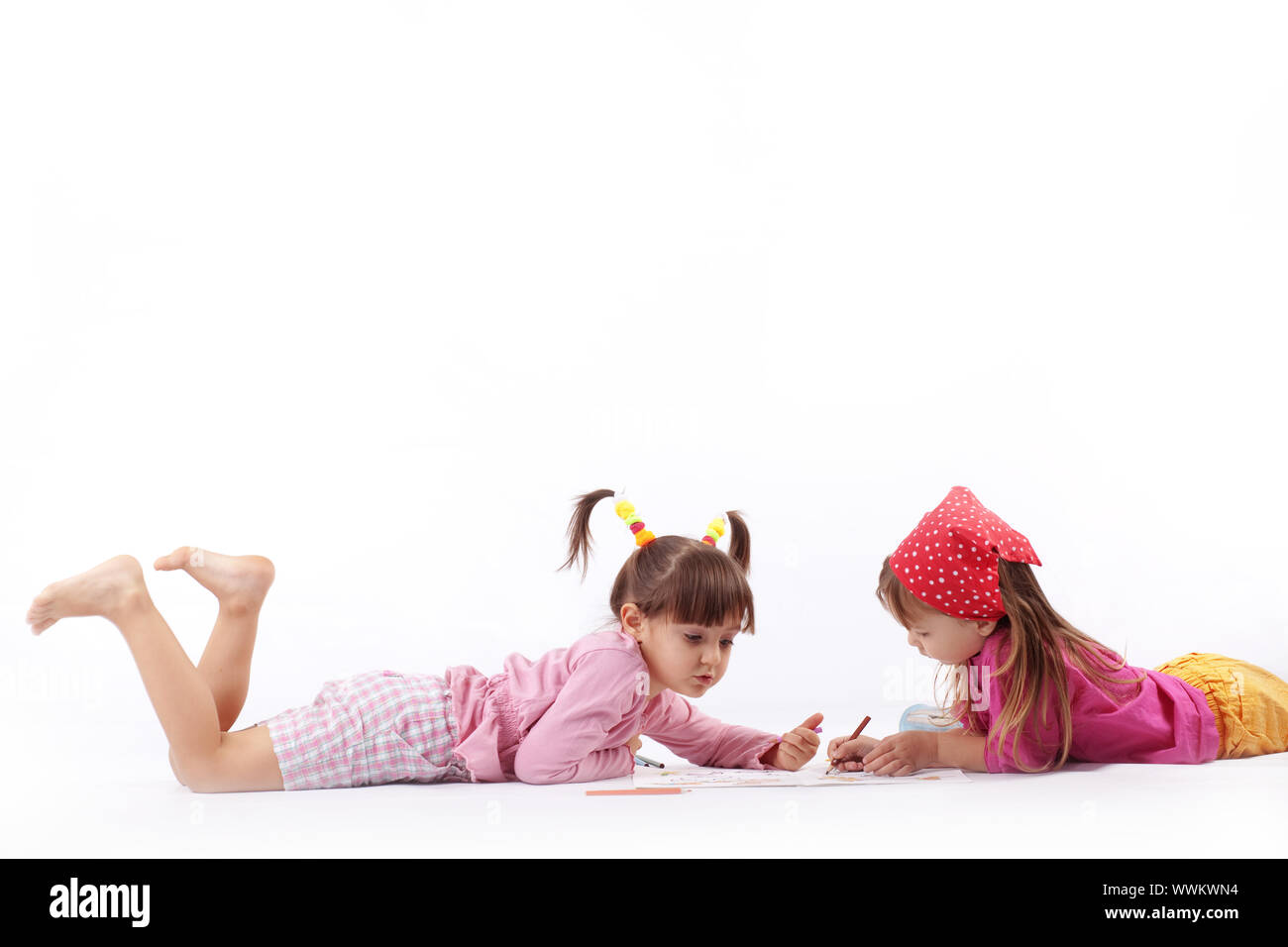Portrait of cute kids drawing over white Stock Photo - Alamy