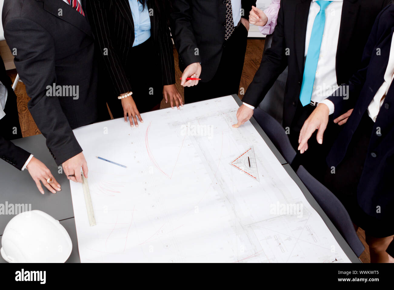 team group conference with architecture and construction plans Stock ...