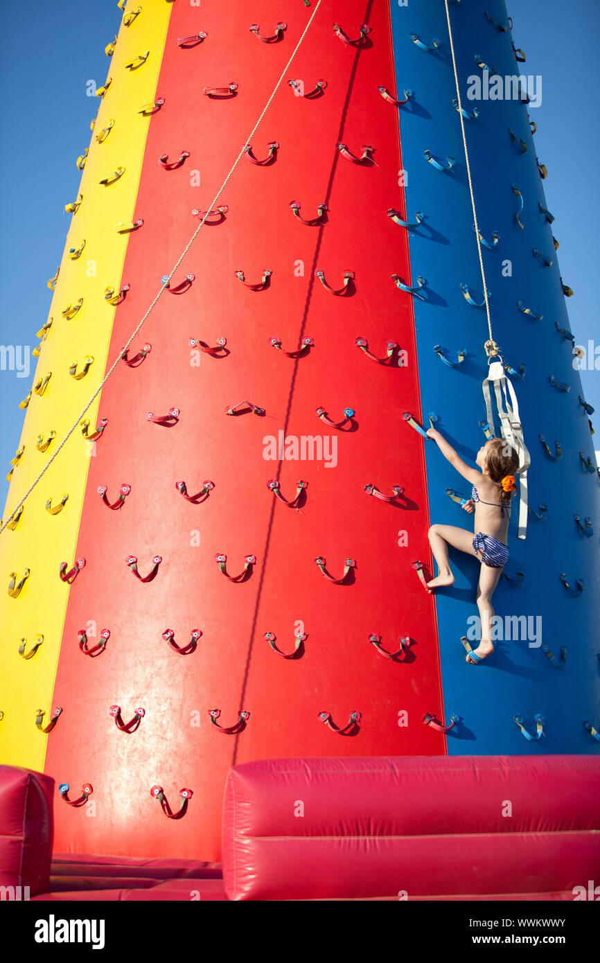 Child climbing on air wall Stock Photo - Alamy