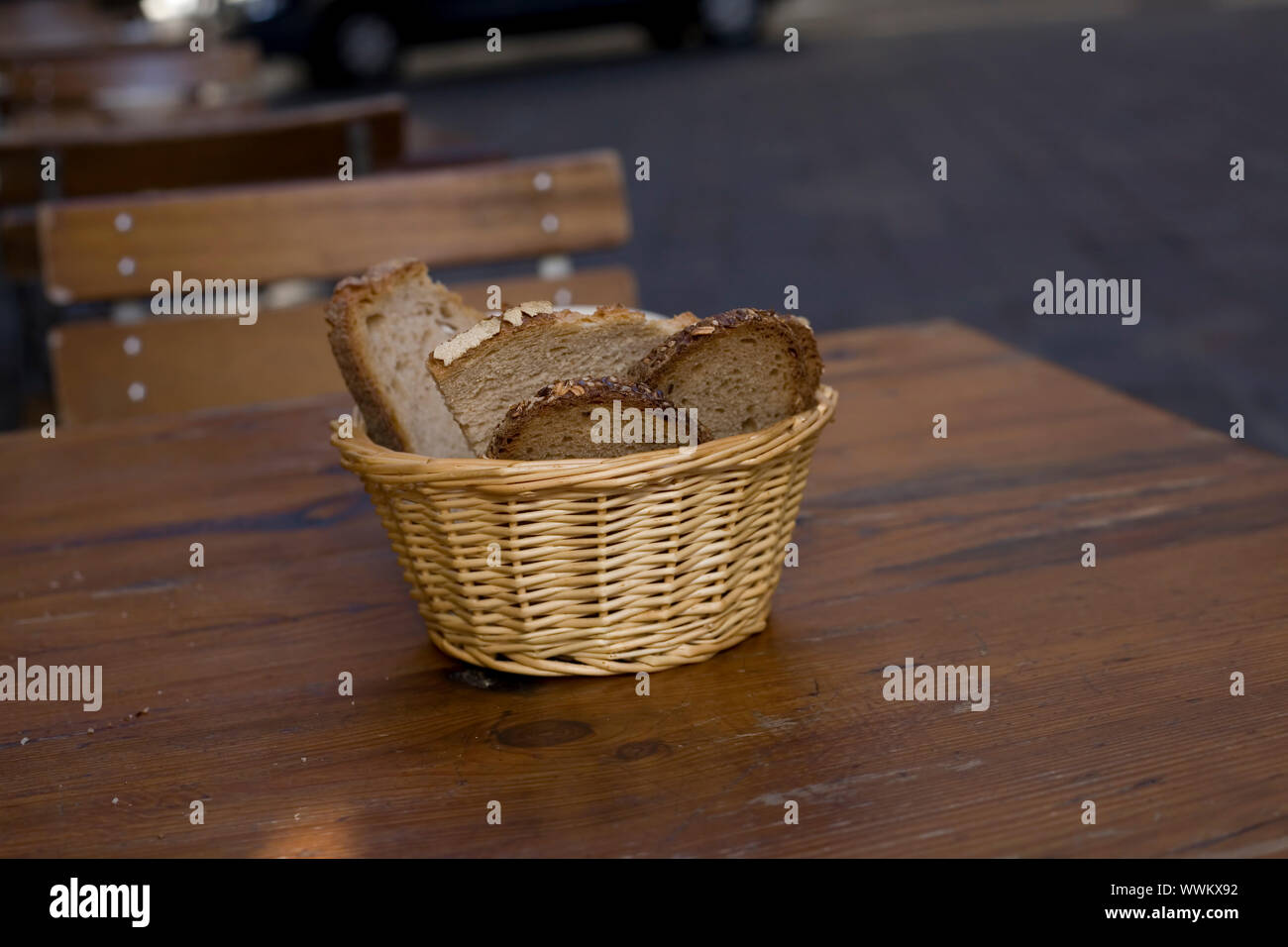 France. Restaurant table with crusty french bread in a basket Stock ...