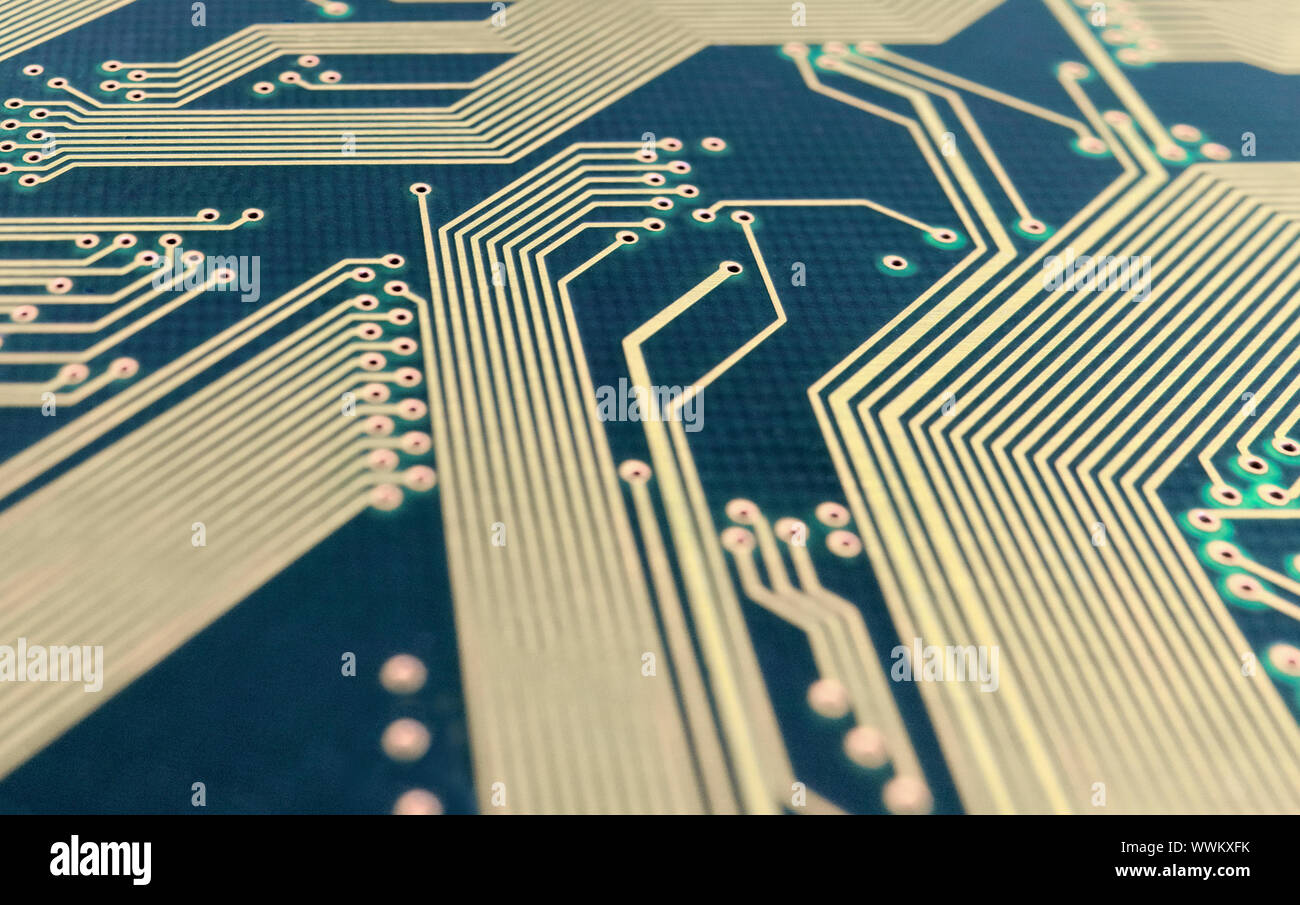 Green old computer plate with golden paths Stock Photo - Alamy