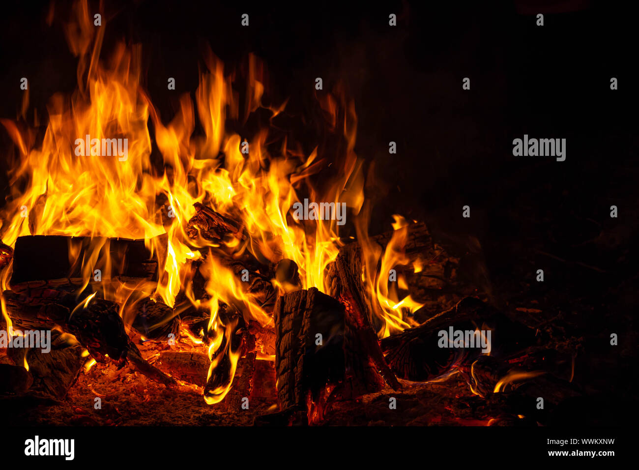 fireplace background burning wood on black Stock Photo - Alamy