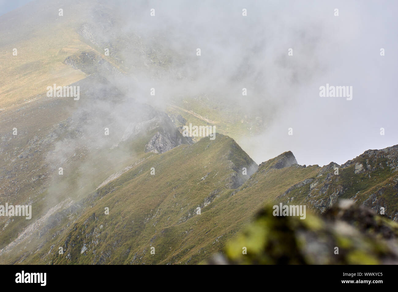 Landscape with mountain range and mist in the late summer Stock Photo ...