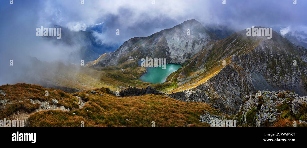 High resolution panorama of Fagaras mountains and lake Capra in Romania ...