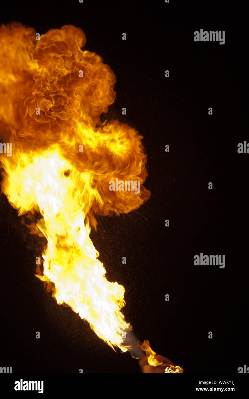 Fire explosion from an fire-breather in the Night Stock Photo - Alamy