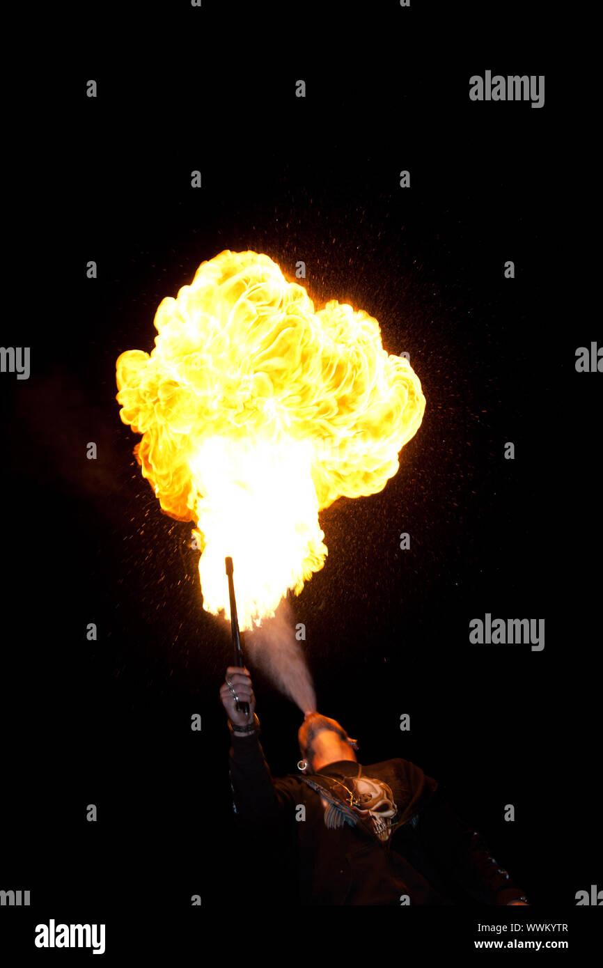 Fire explosion from an fire-breather in the Night Stock Photo - Alamy
