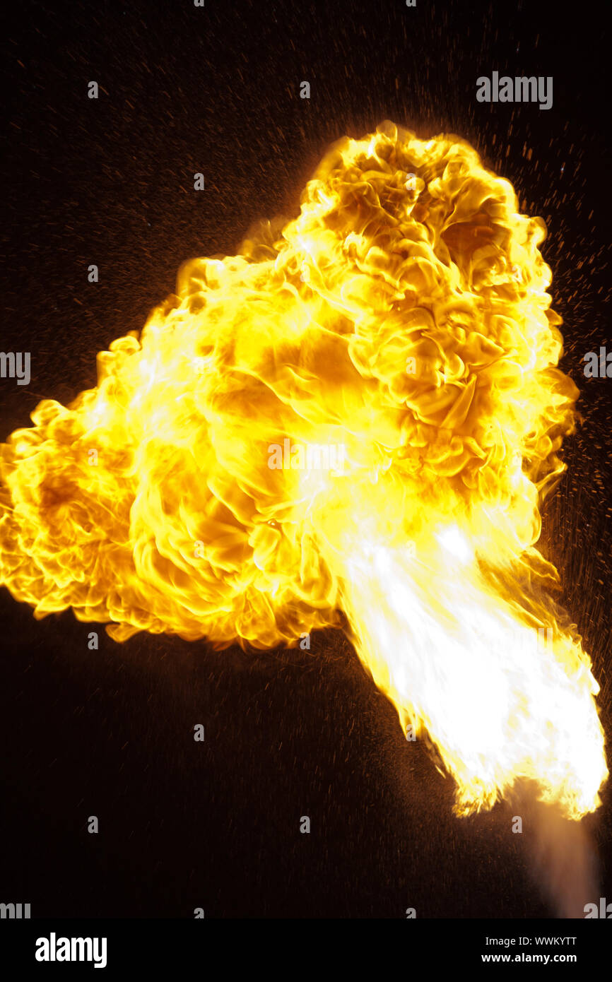 Fire explosion from an fire-breather in the Night Stock Photo - Alamy