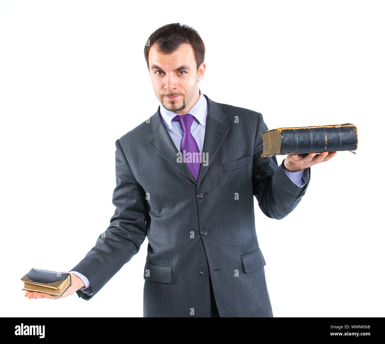 Portrait of a business man with book isolated on white background ...