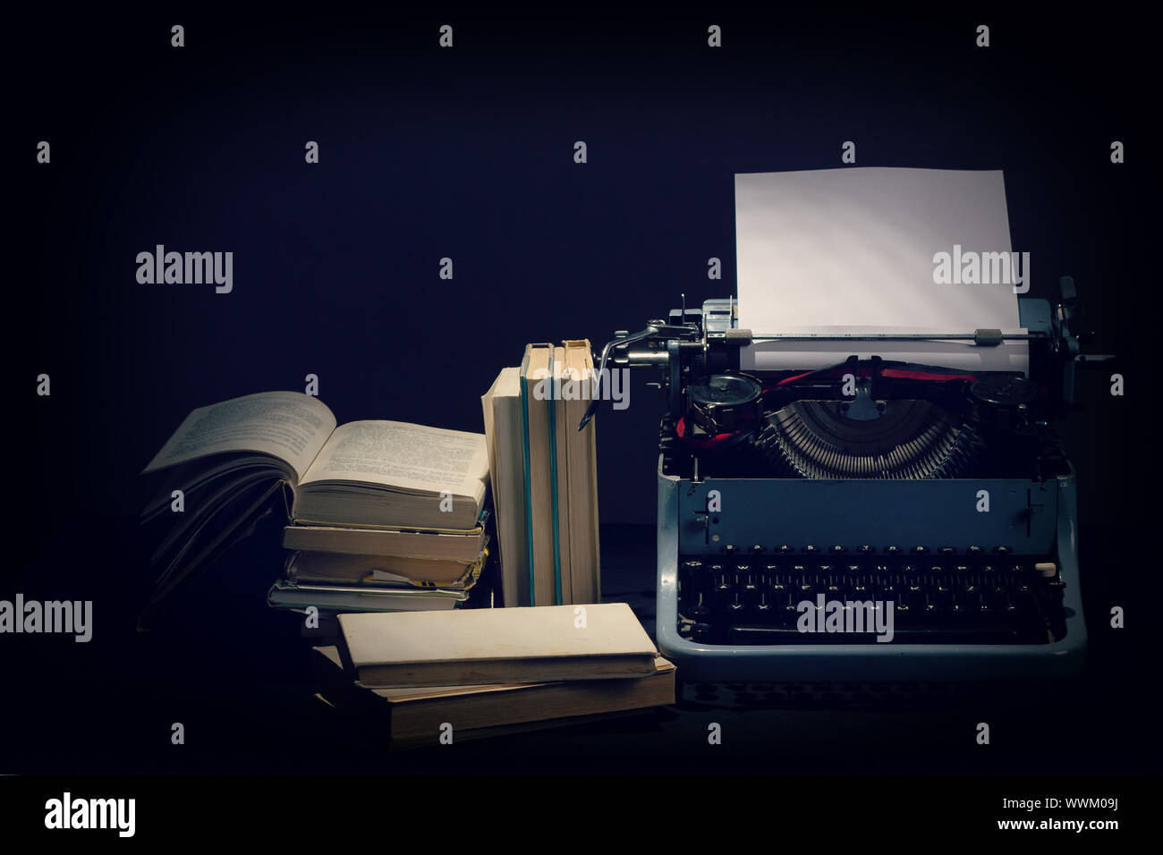Old typewriter with opened books hi-res stock photography and images ...