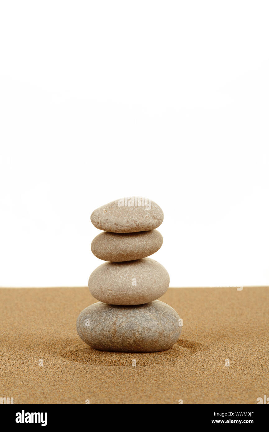 Balance zen stones in sand on white Stock Photo - Alamy
