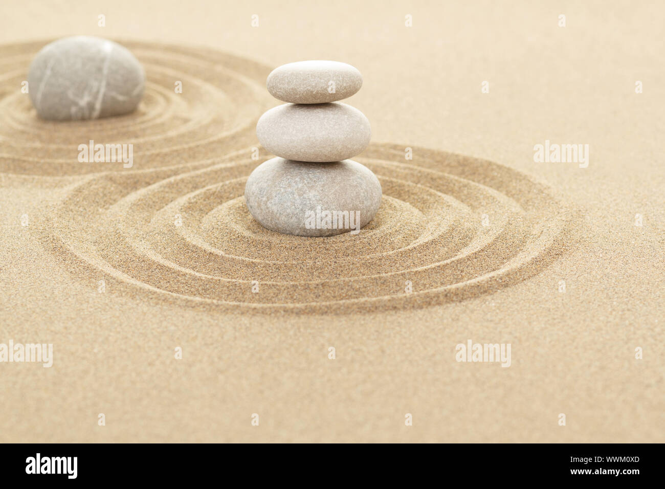 Balance zen stones in sand Stock Photo - Alamy