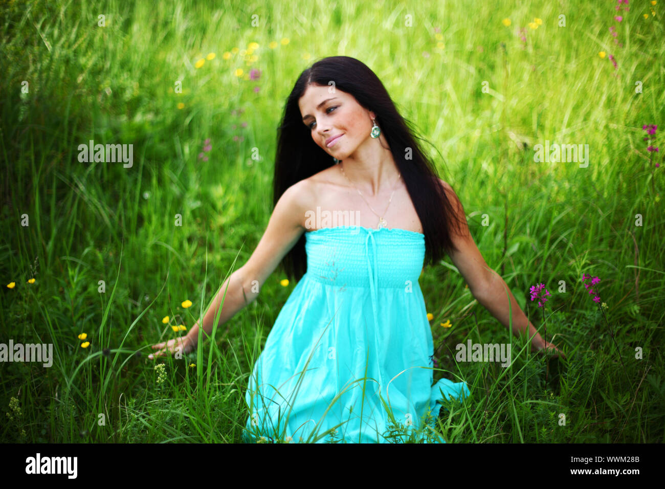 beautiful woman on flower field Stock Photo - Alamy