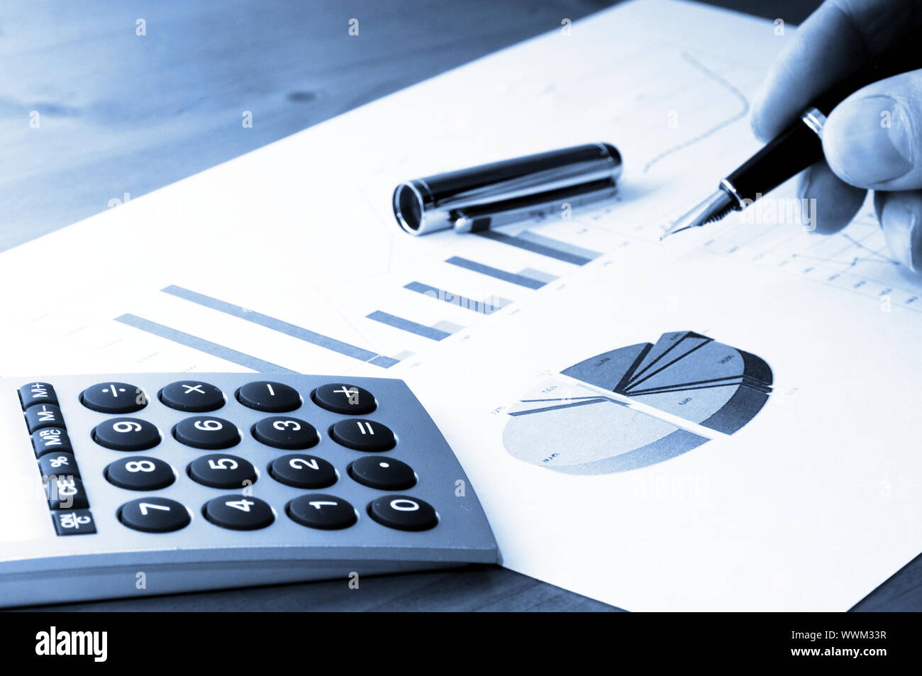 business data in office with hand witch calculator Stock Photo - Alamy