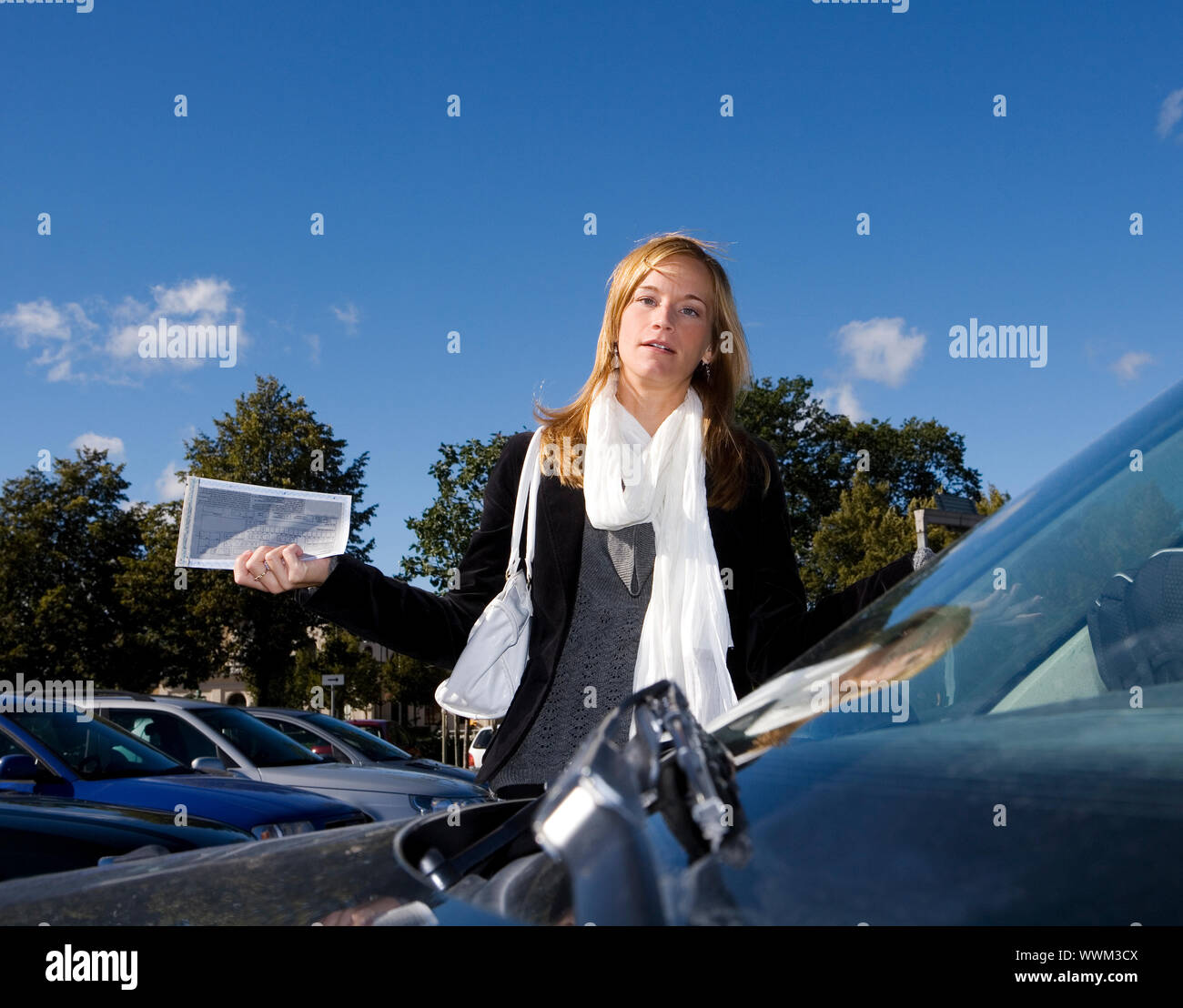 Angry woman getting a Parking Ticket Stock Photo - Alamy