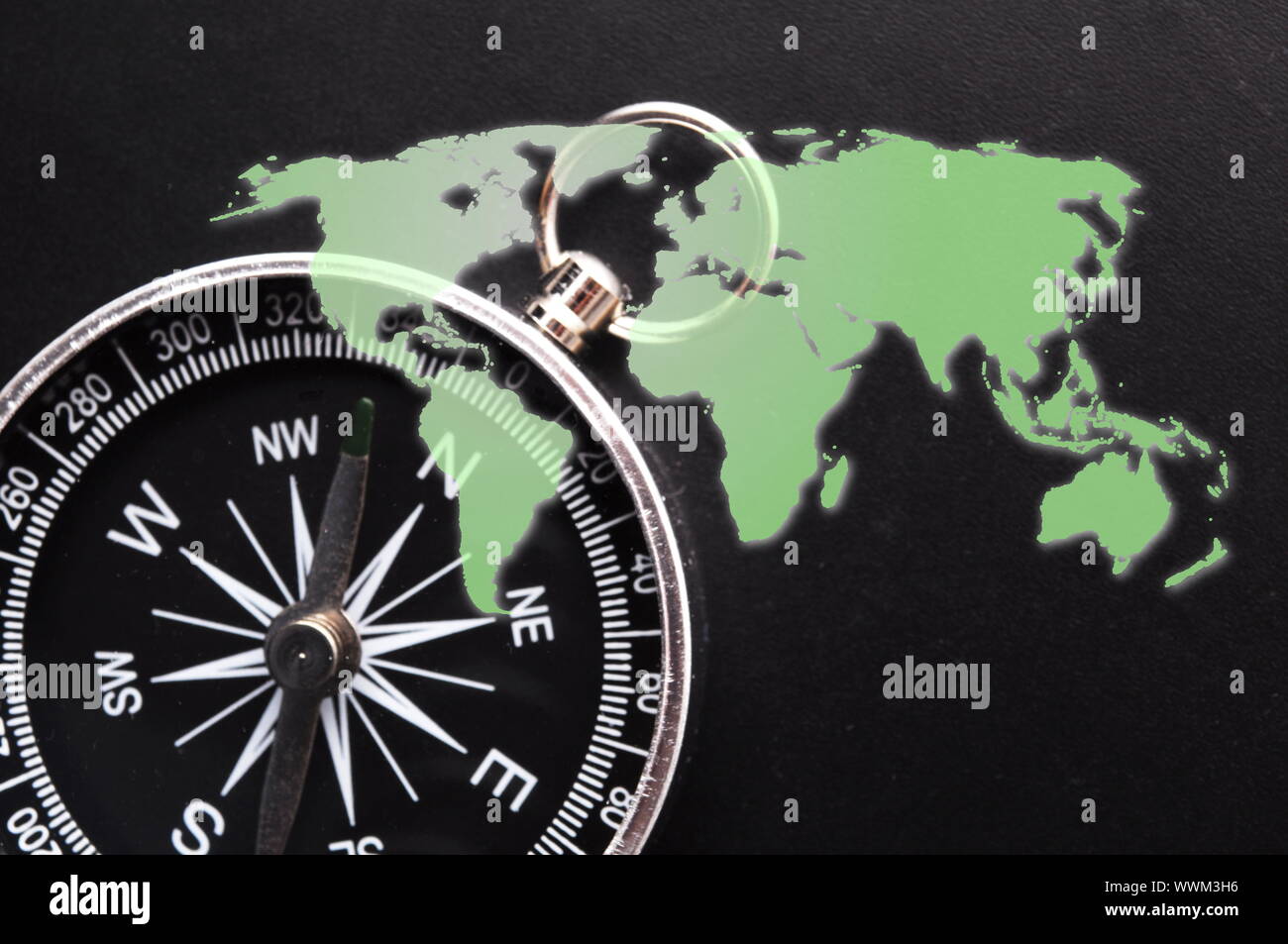 world map and compass showing business guidance concept Stock Photo - Alamy