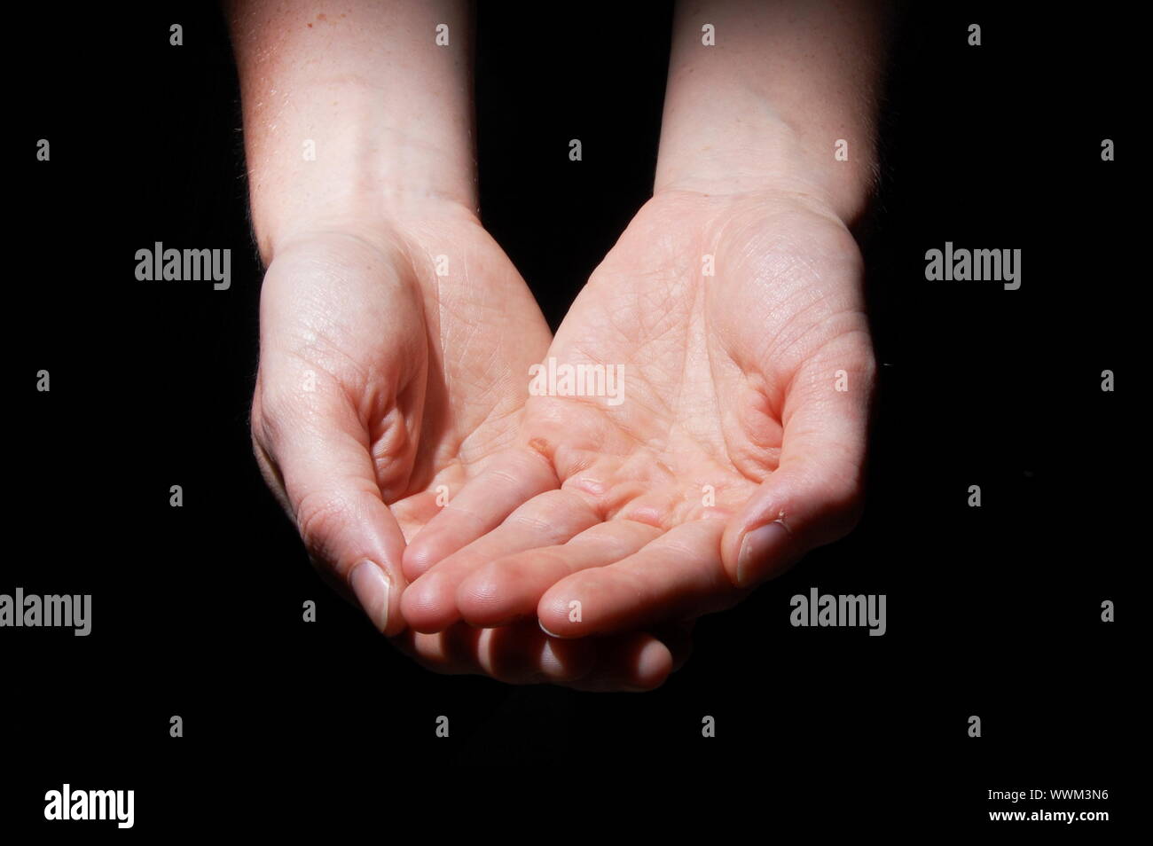 empty hands isolated on a black background Stock Photo - Alamy
