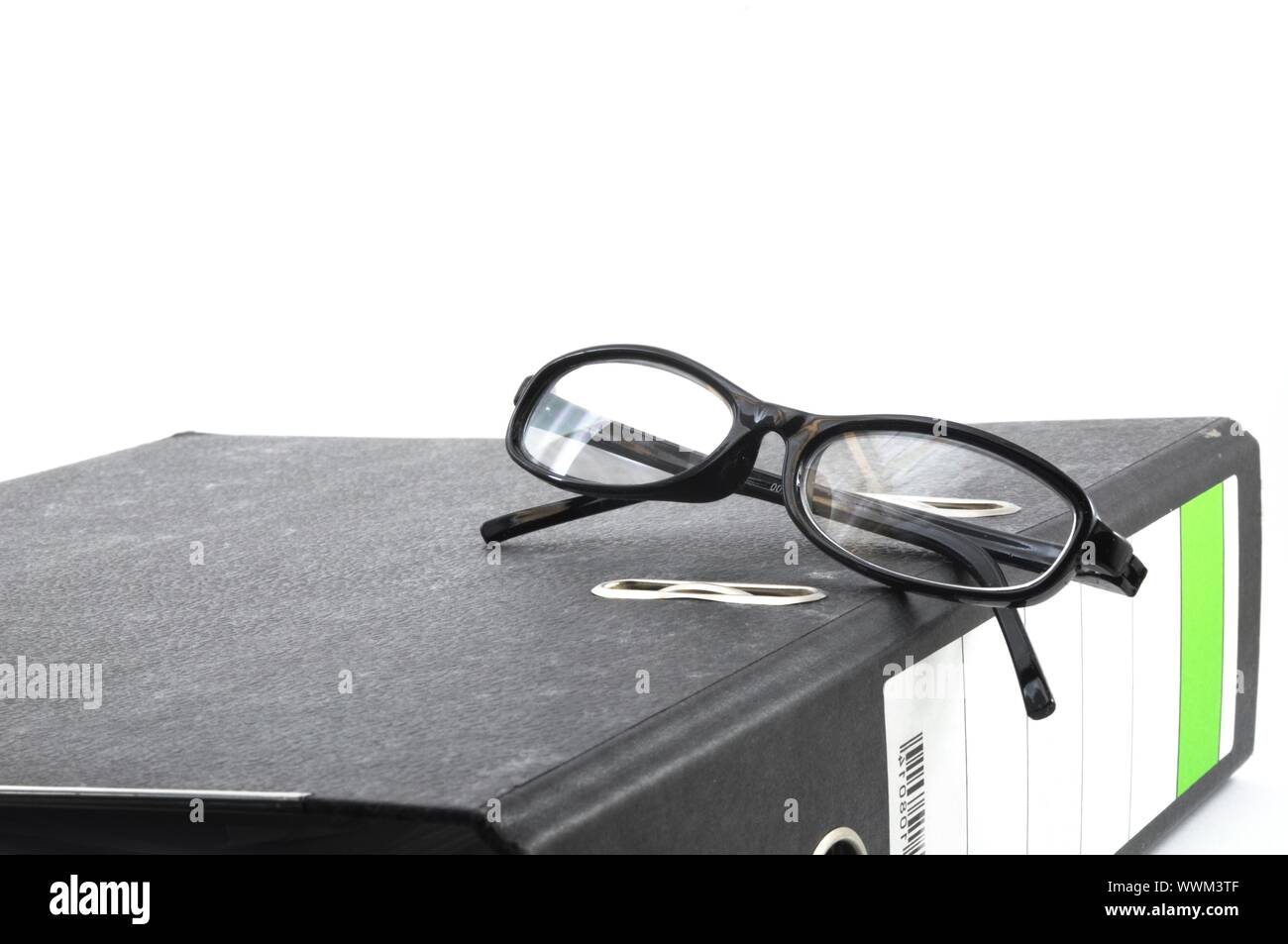 eye glasses and folder in the office showing paperwork concept Stock ...