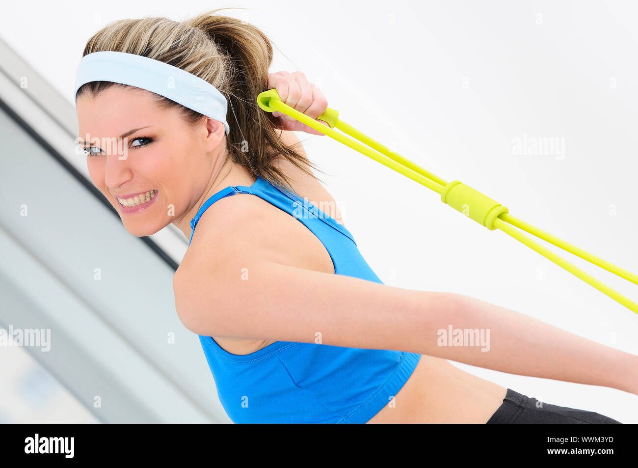 athletic woman doing gymnastic exercises with an elastic fitness Stock ...