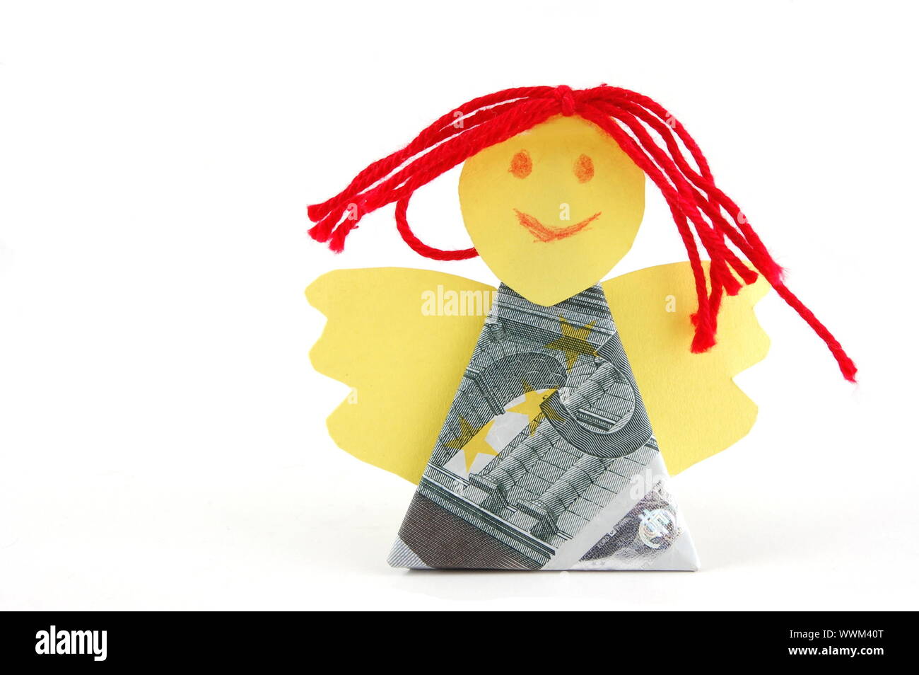 Angel made of money isolated on white background Stock Photo - Alamy