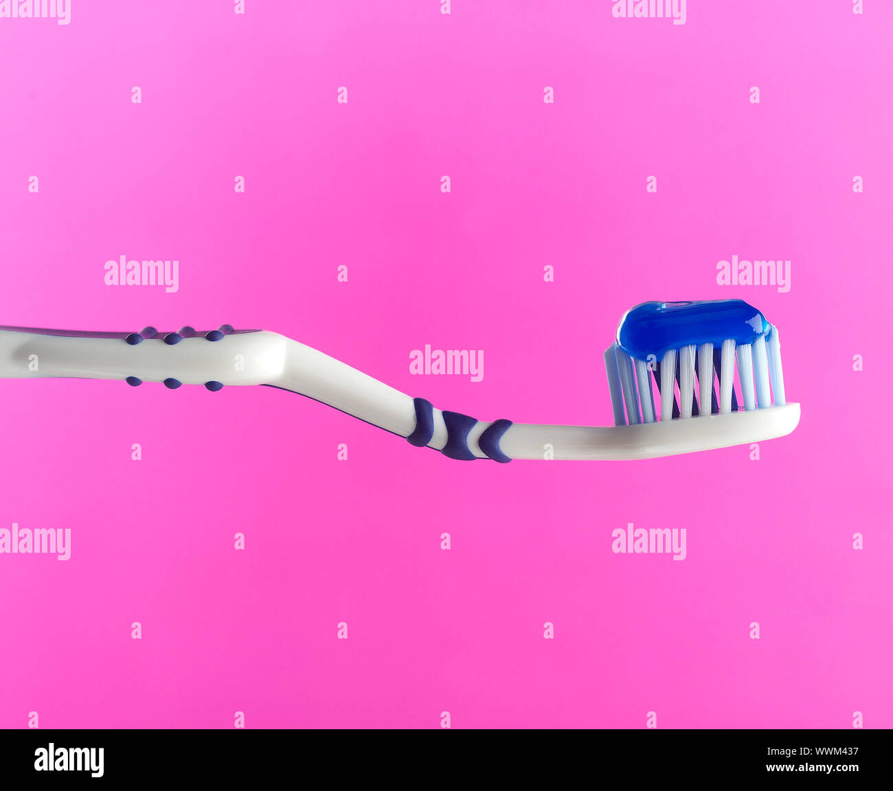 Toothbrush with toothpaste on pink background Stock Photo - Alamy