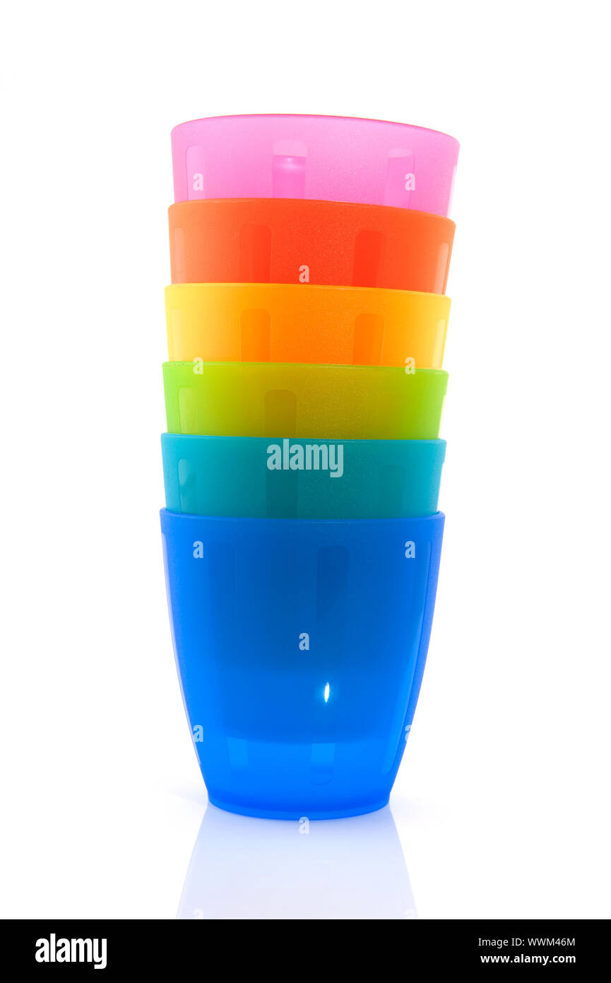 stacked colorful plastic mugs isolated over white Stock Photo - Alamy