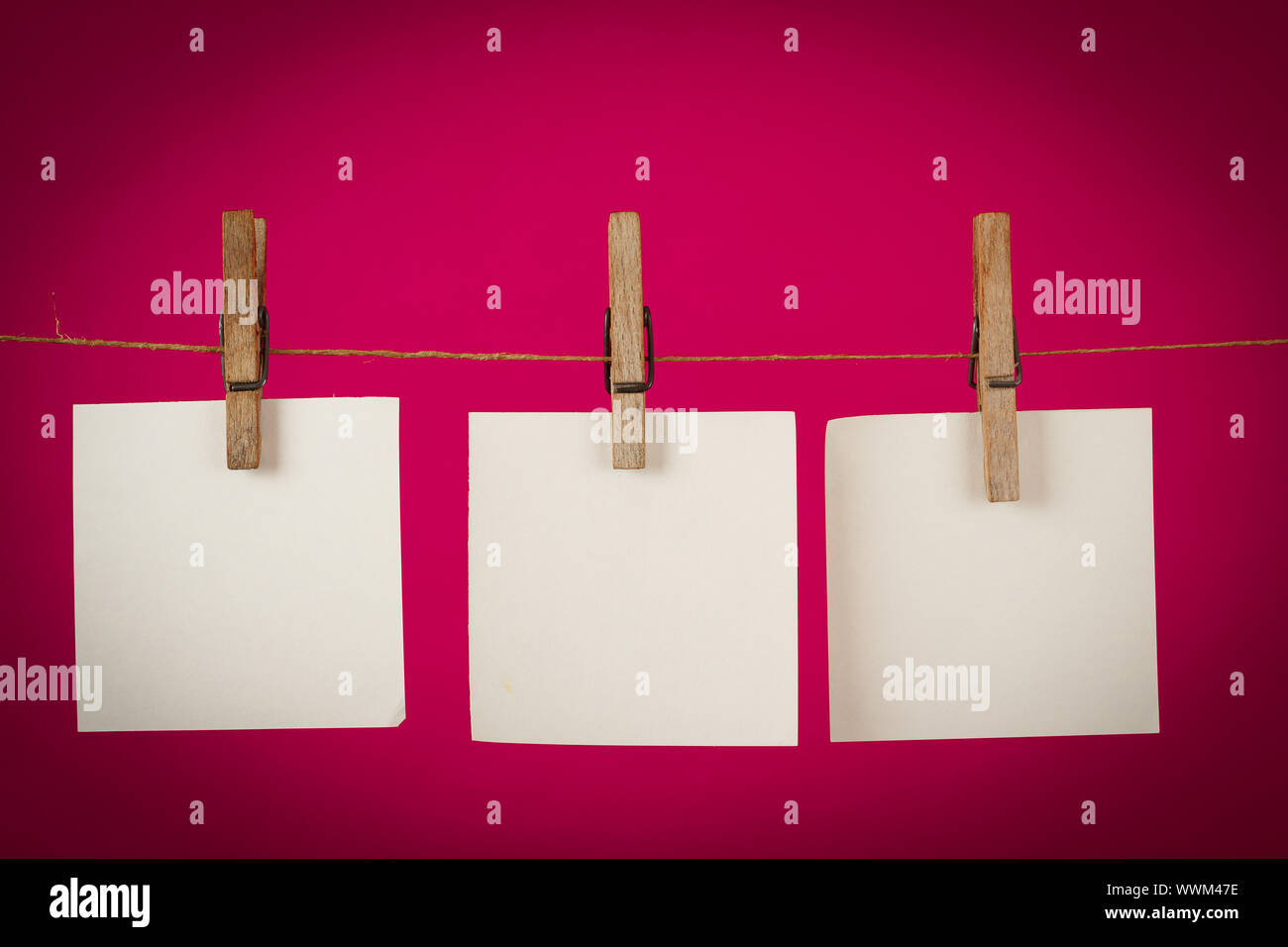 Memory note papers hanging on cord Stock Photo - Alamy