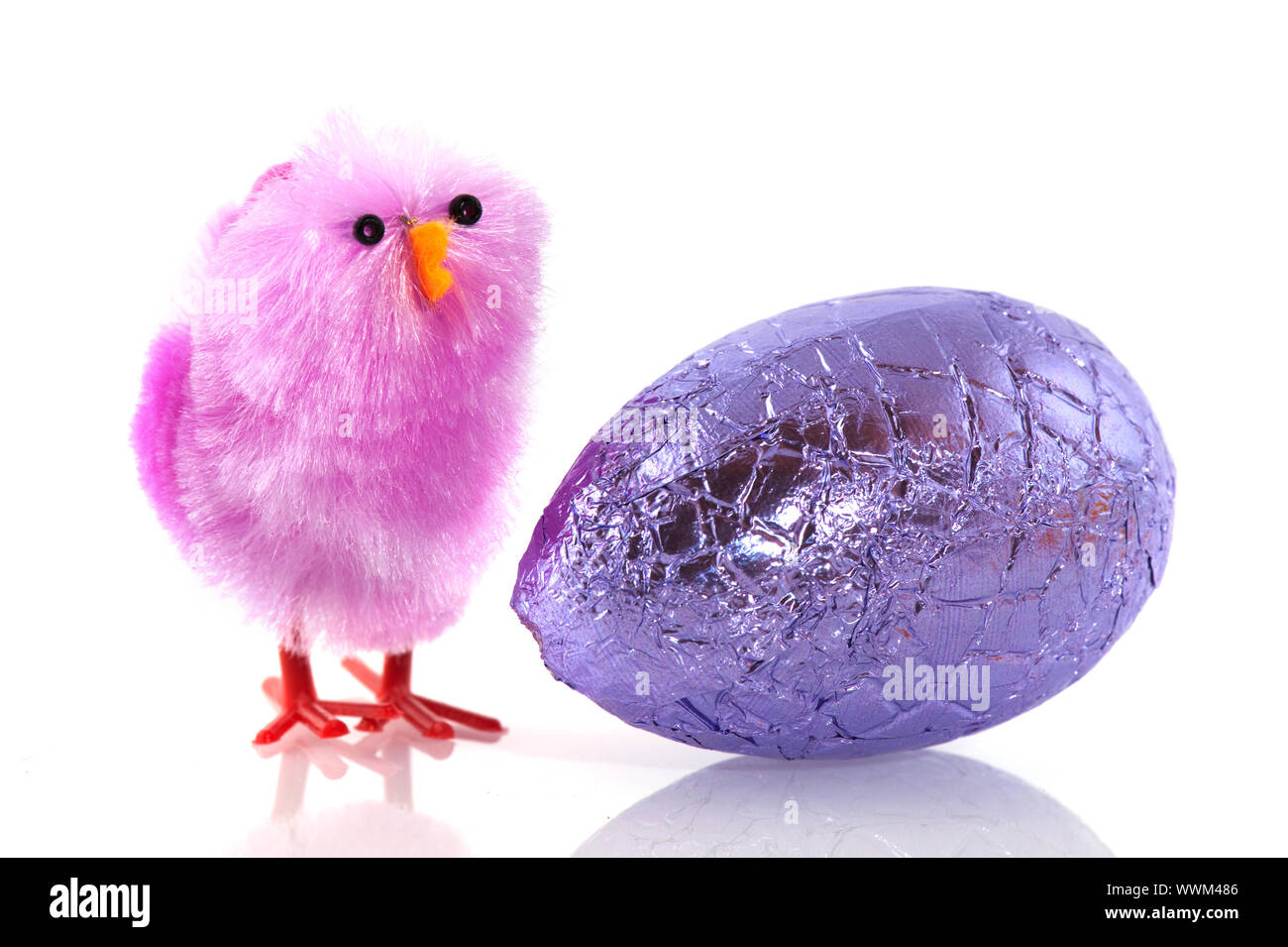 Little pink easter chick with chocolate egg Stock Photo - Alamy