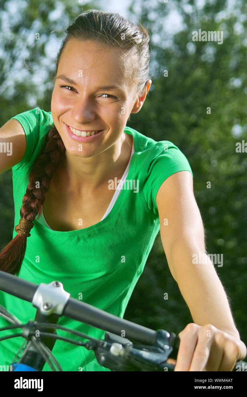 Active lady a bike ride in the park Stock Photo - Alamy