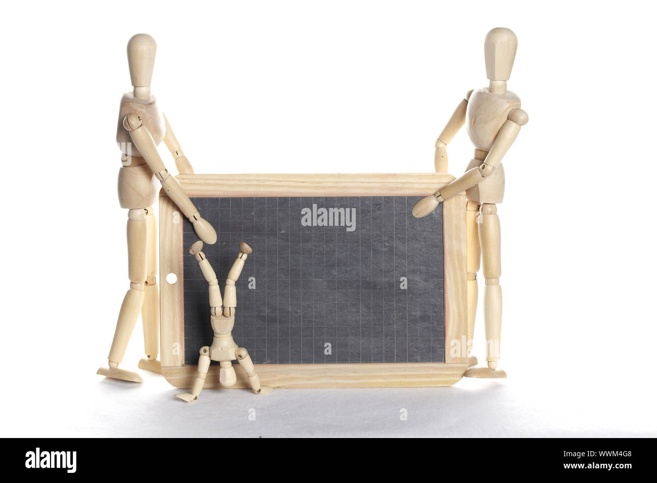 Articulated puppets hold slate tablet Stock Photo - Alamy
