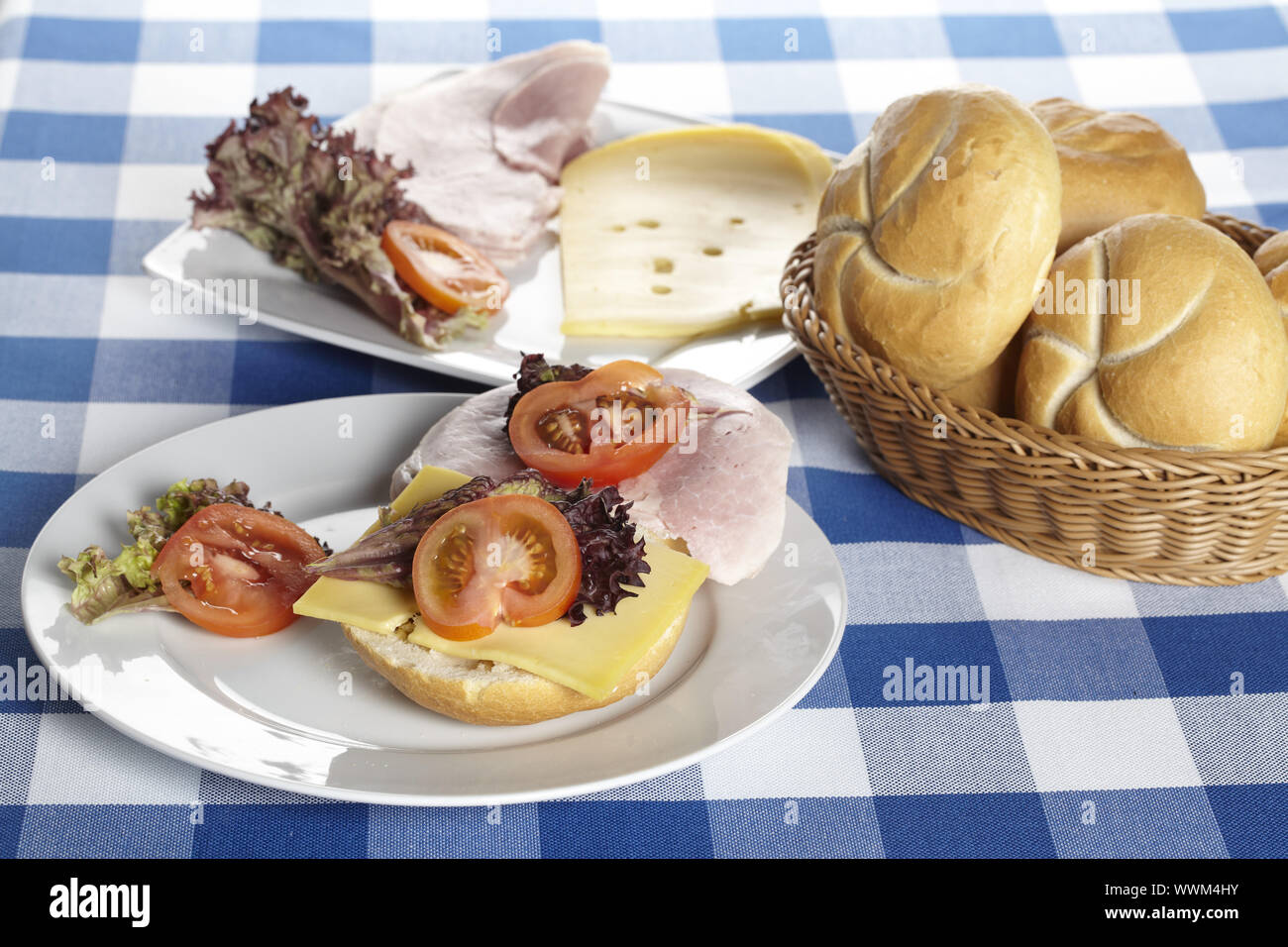 ham and cheese roll with basket and plate Stock Photo - Alamy