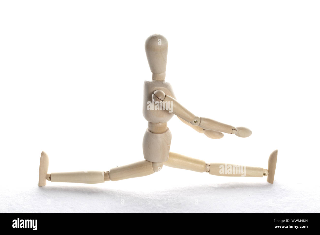 Dolls with links - balancing act Stock Photo - Alamy