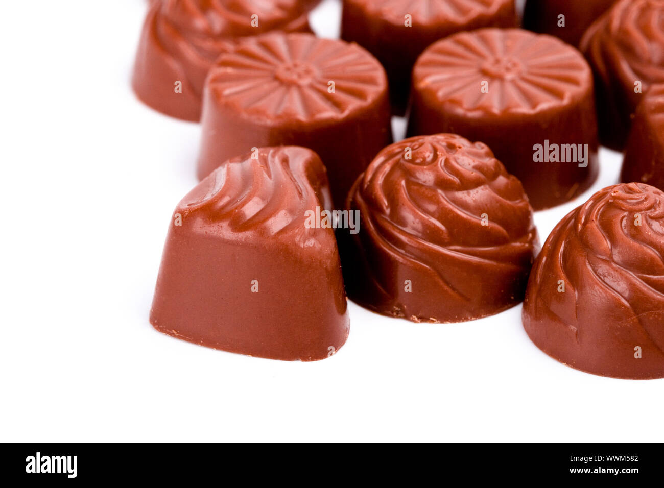 chocolate sweets closeup on a white background Stock Photo - Alamy