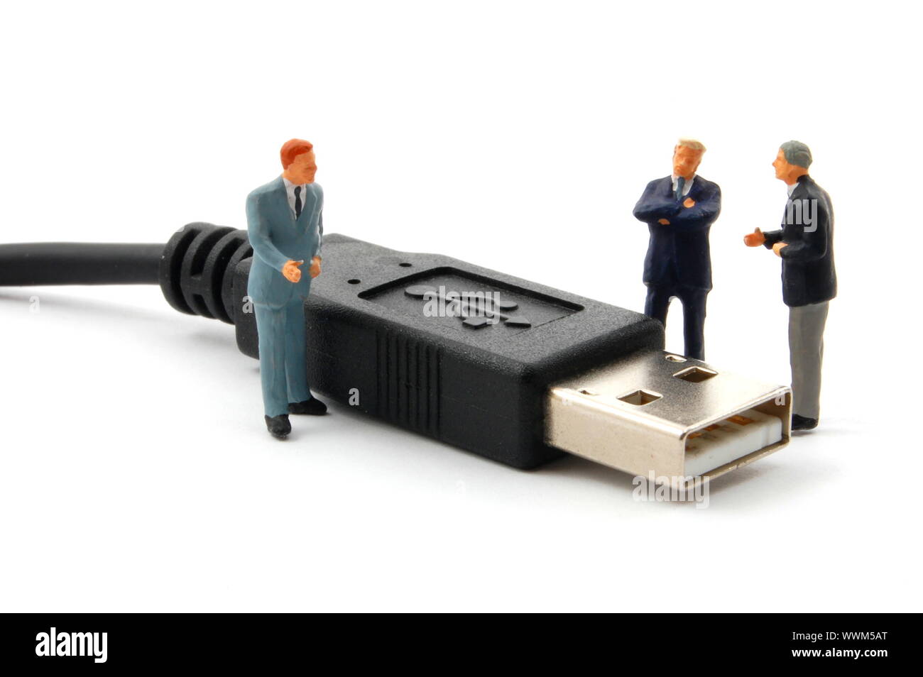 tiny toy business man and usb connector isolated on white Stock Photo ...