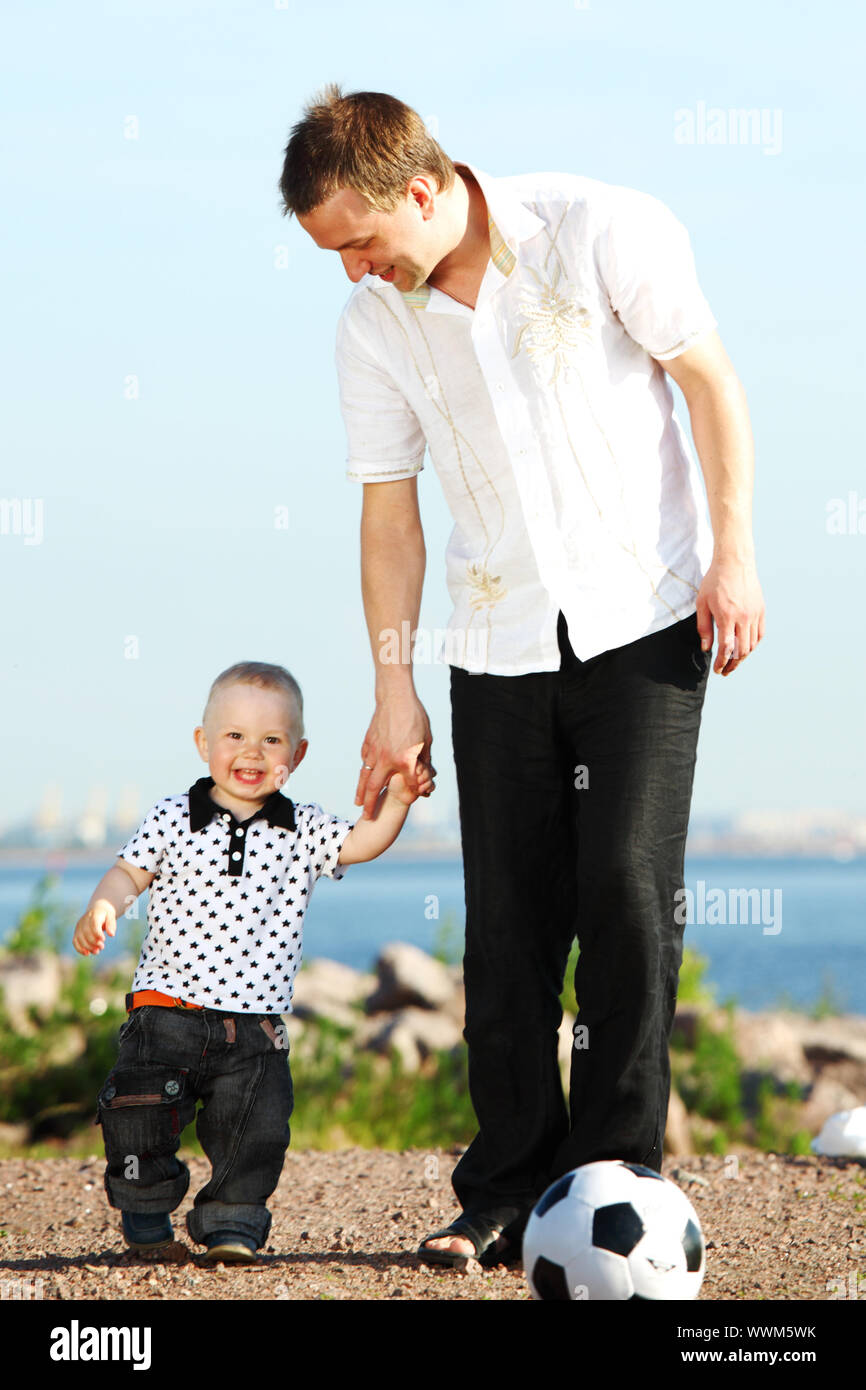 little boy play soccer outdoor Stock Photo - Alamy