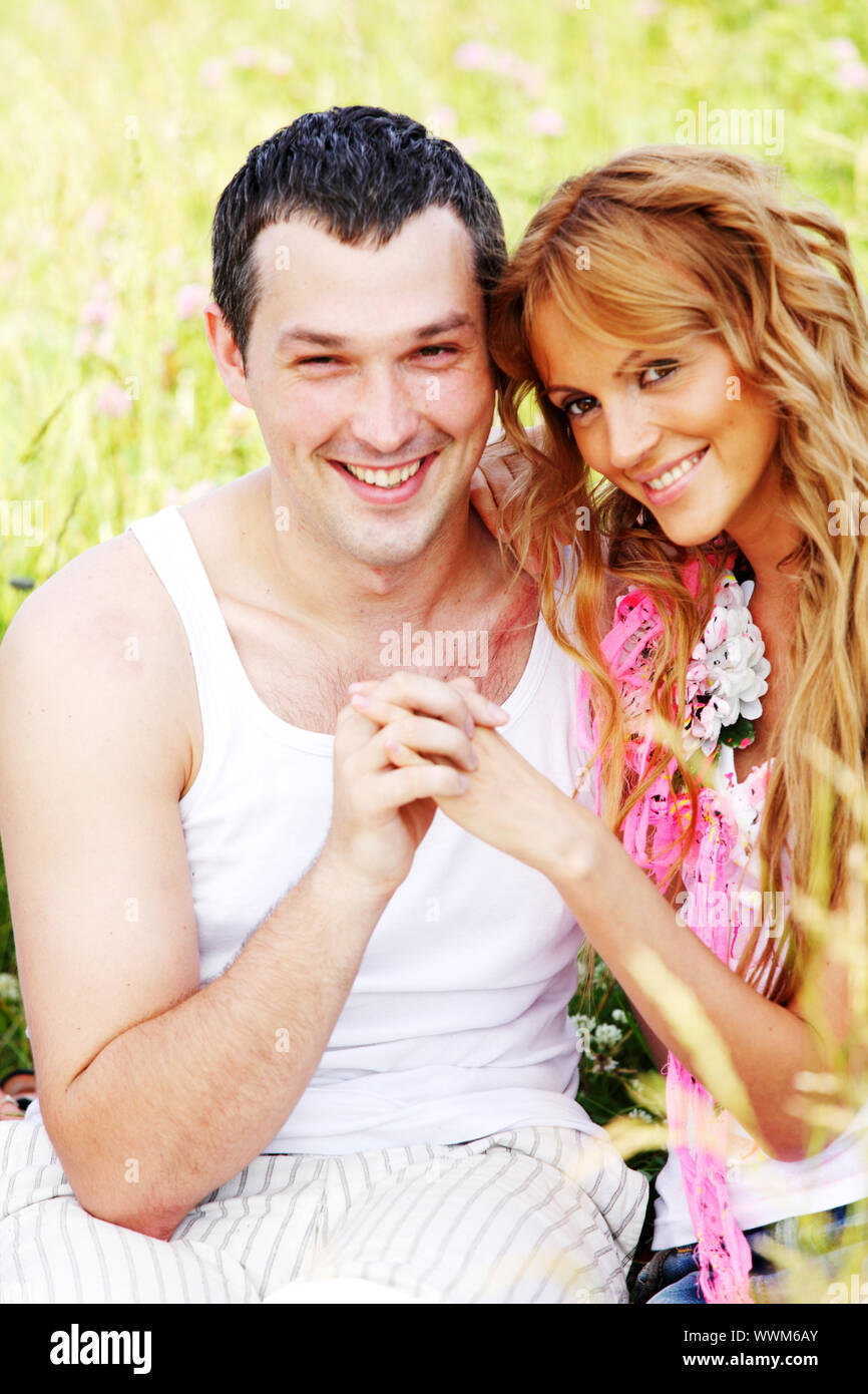two lovers on grass field Stock Photo - Alamy