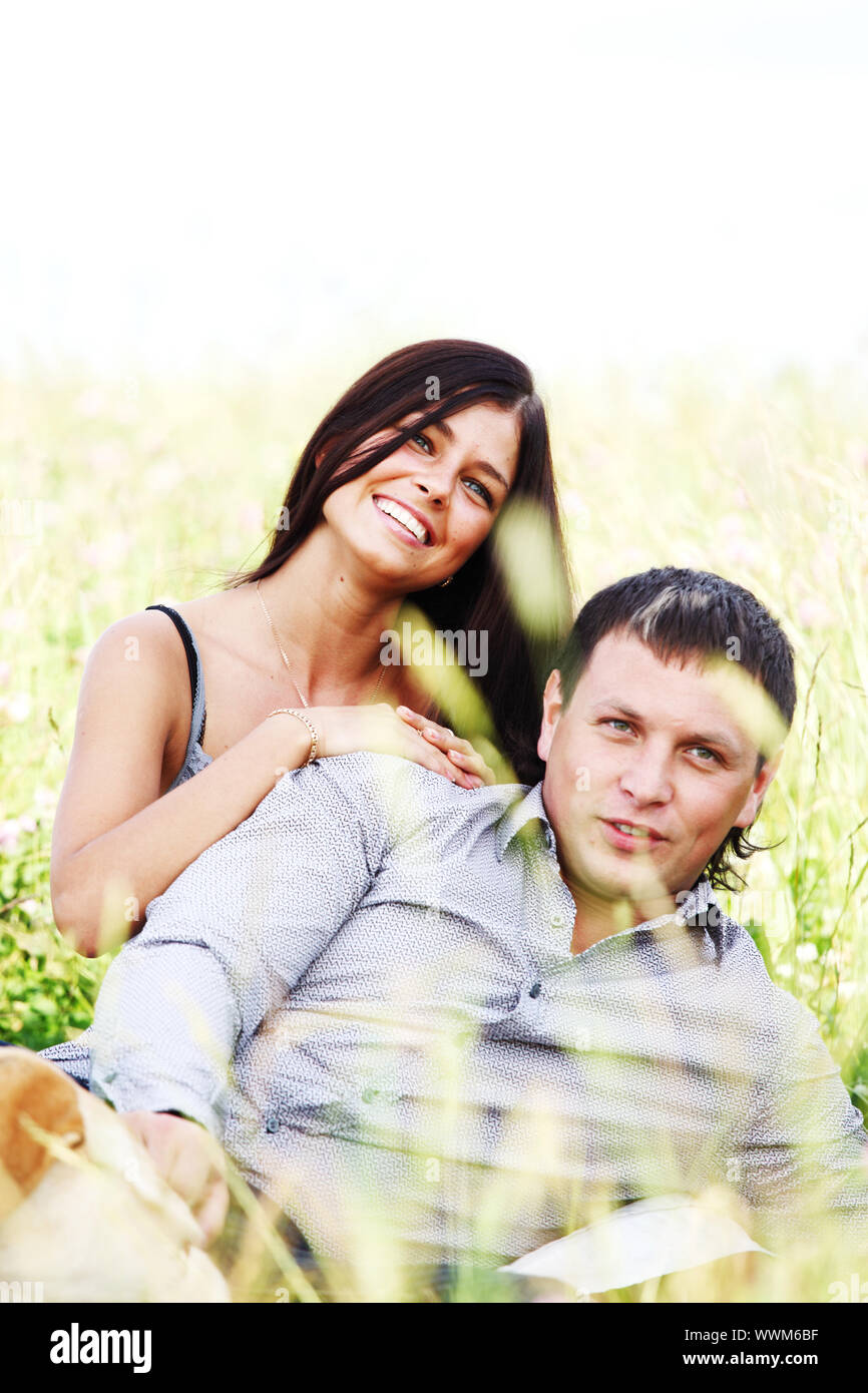 two lovers on grass field Stock Photo - Alamy