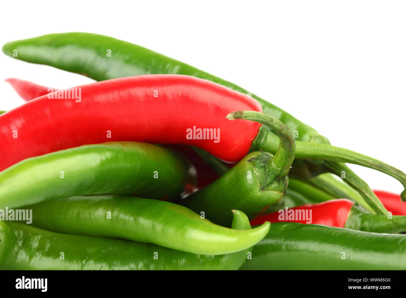 mixed chilli pile isolated on white Stock Photo - Alamy