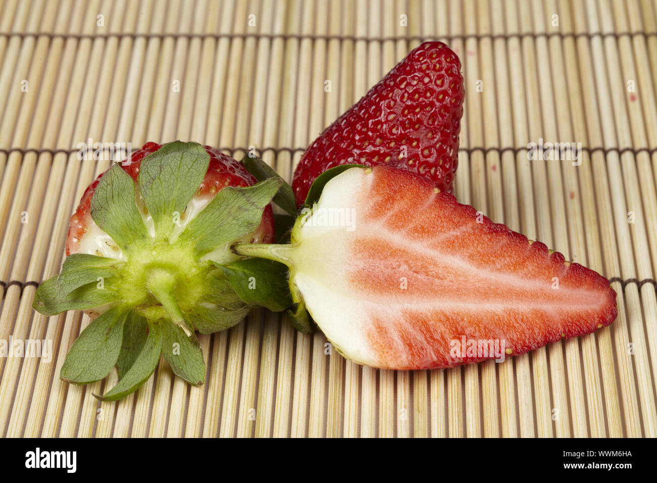 Strawberries on a straw set Stock Photo - Alamy
