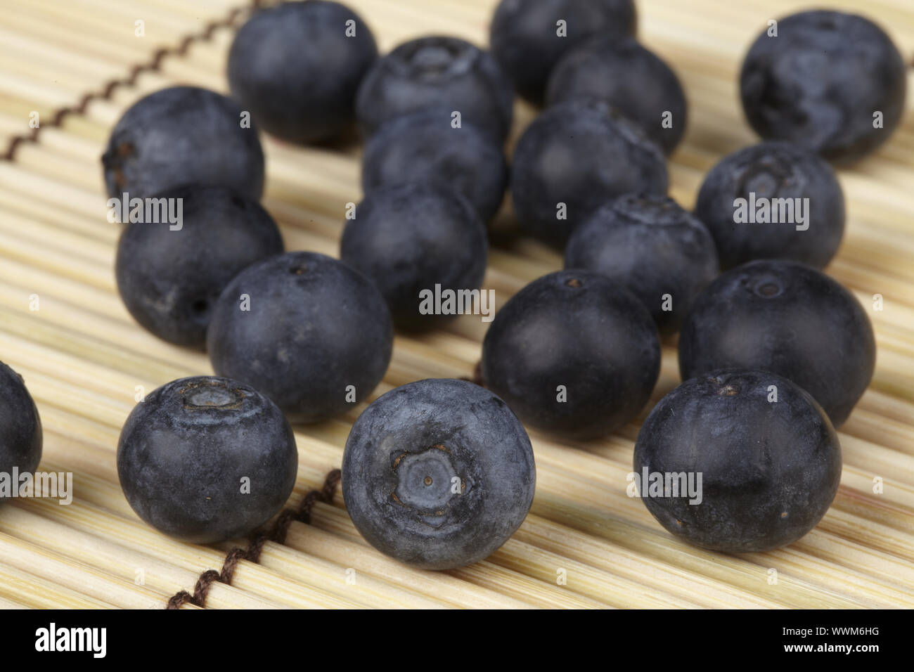 Blueberries on a straw set Stock Photo - Alamy