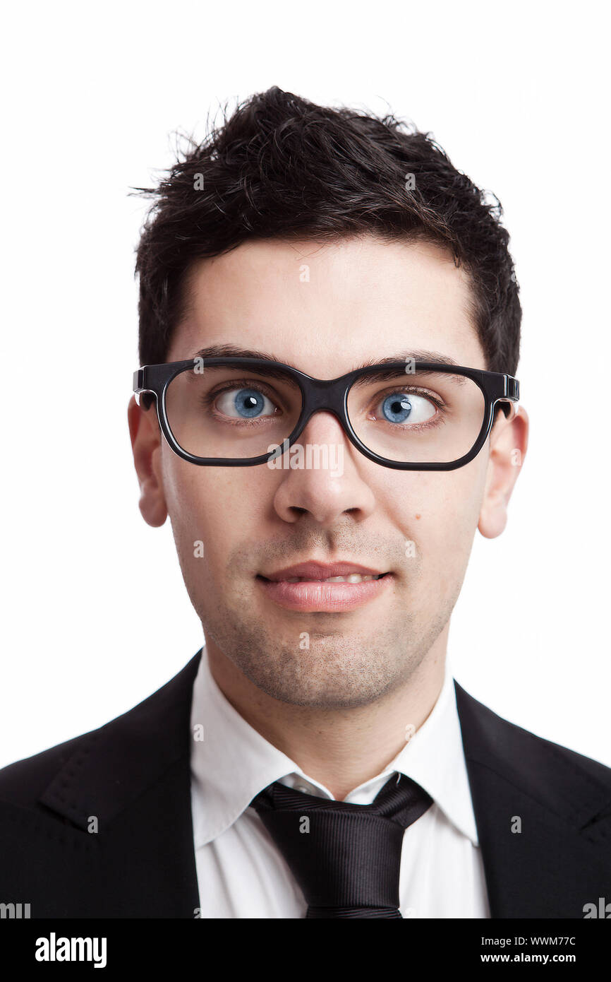 Funny portrait of a young businessman with crooked eyes wearing nerd ...
