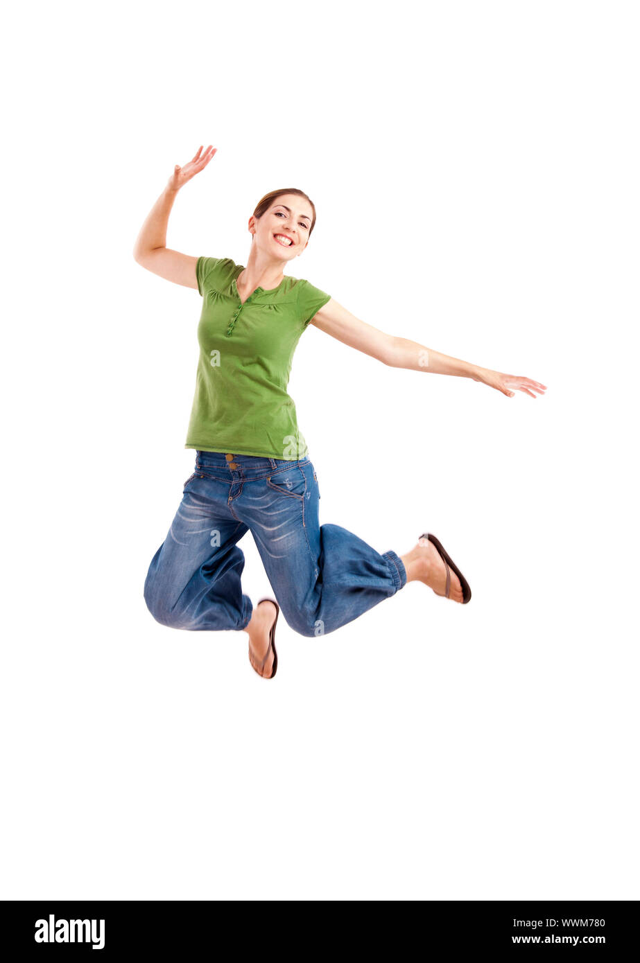 Beautiful happy woman jumping over a white background Stock Photo - Alamy
