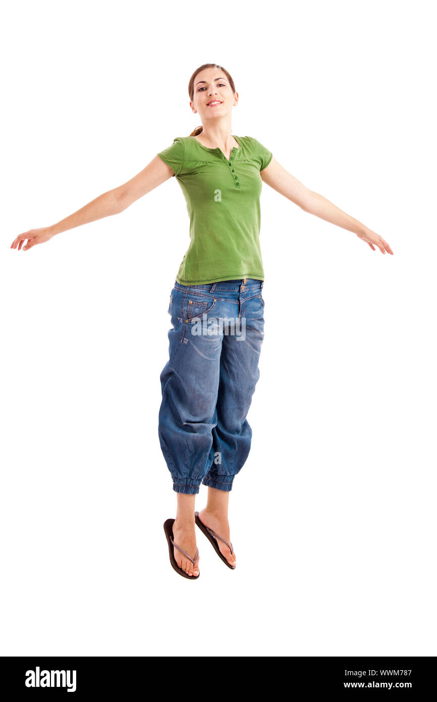 Beautiful happy woman jumping over a white background Stock Photo - Alamy