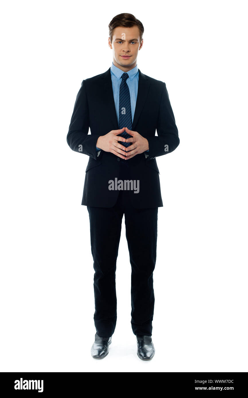 Confident executive standing in business suit isolated on white ...