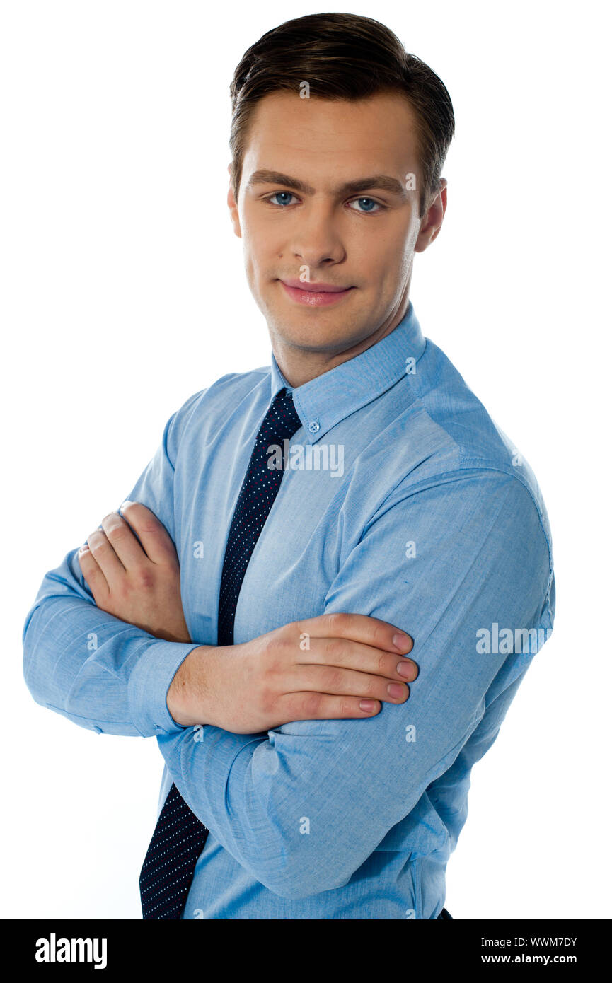 Businessman hposing with folded arms against white background Stock Photo - Alamy