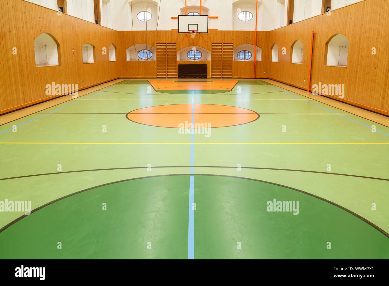 Empty interior of public gym with basketball court Stock Photo - Alamy