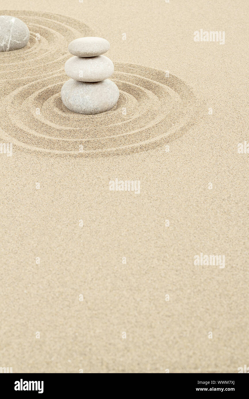Balance zen stones in sand Stock Photo - Alamy