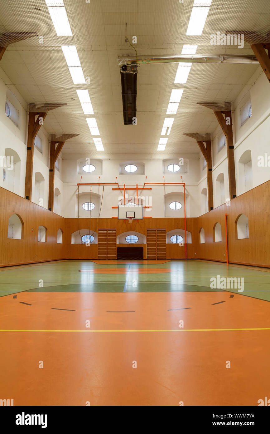 Empty interior of public gym with basketball court Stock Photo - Alamy